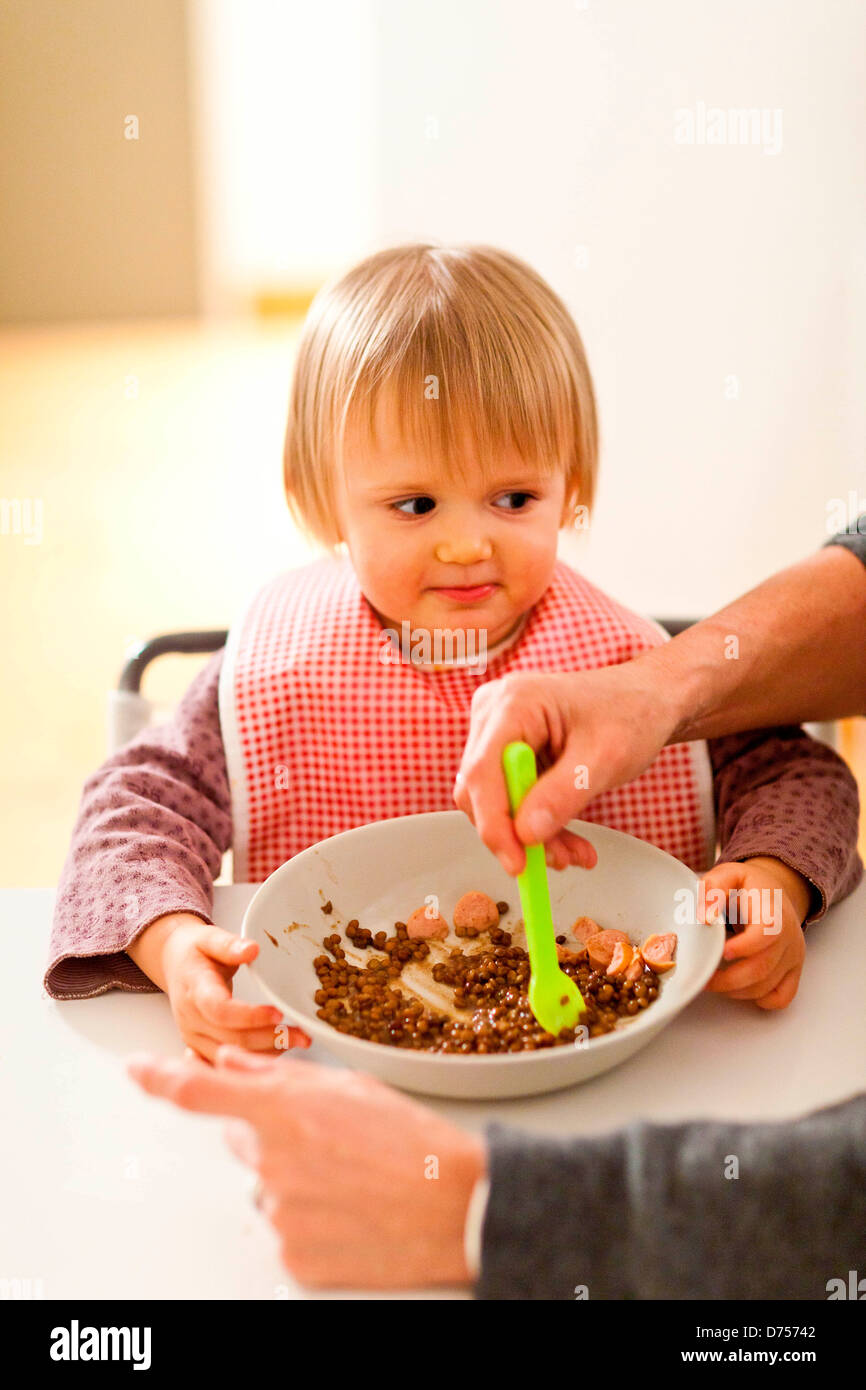 Spoon feeding month old baby girl hi-res stock photography and images ...