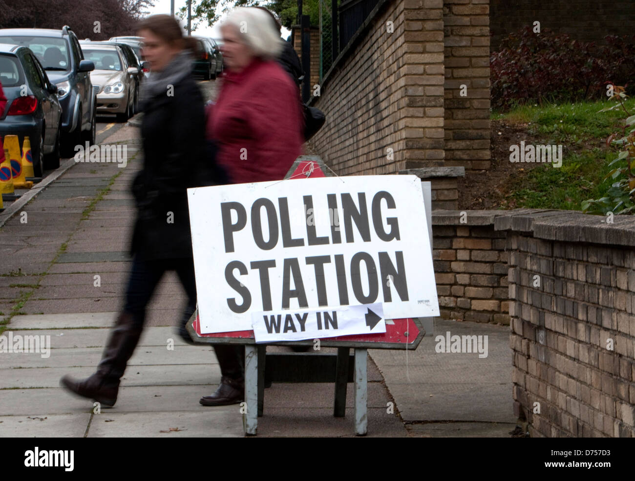polling station signs with people coming and going, in north west ...