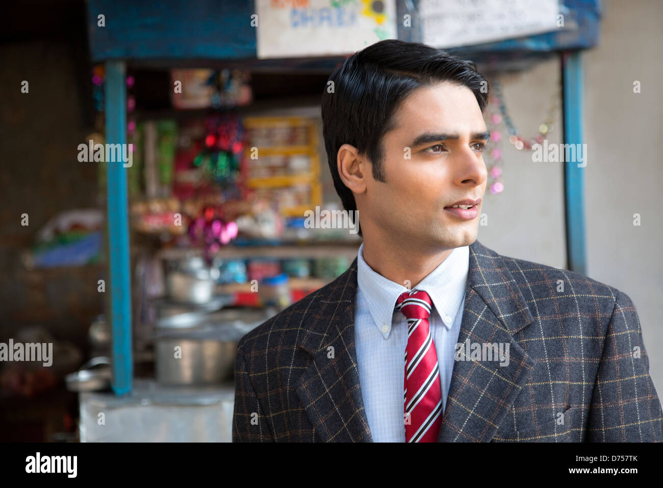 Close-up of a businessman looking curiously Stock Photo - Alamy