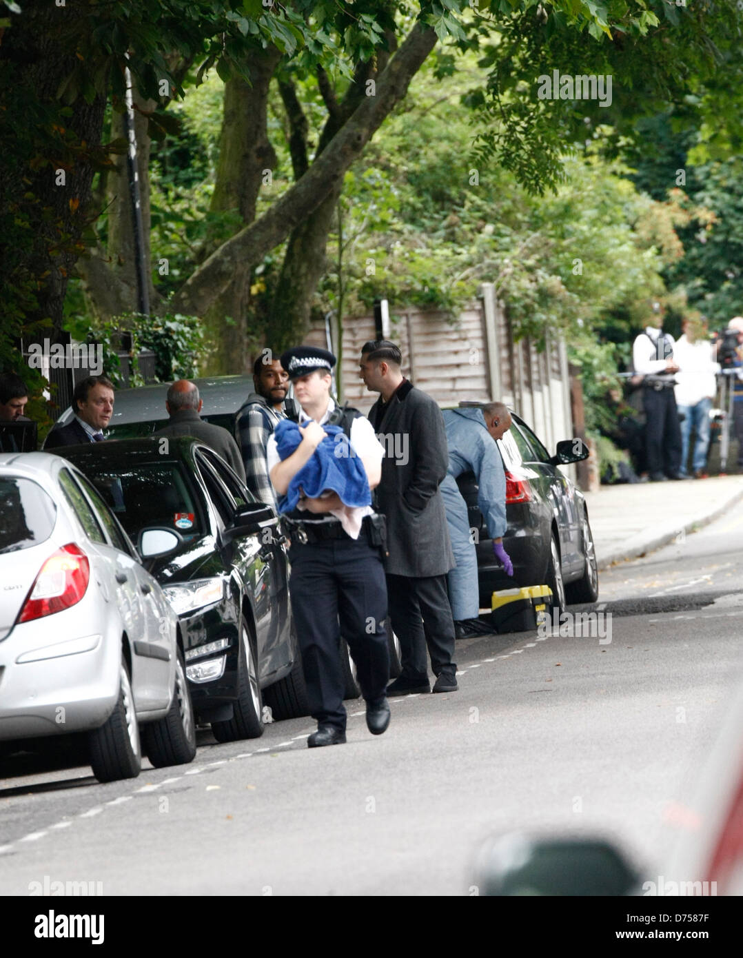 Reg Traviss is seen outside Amy Winehouse's home during the police ...