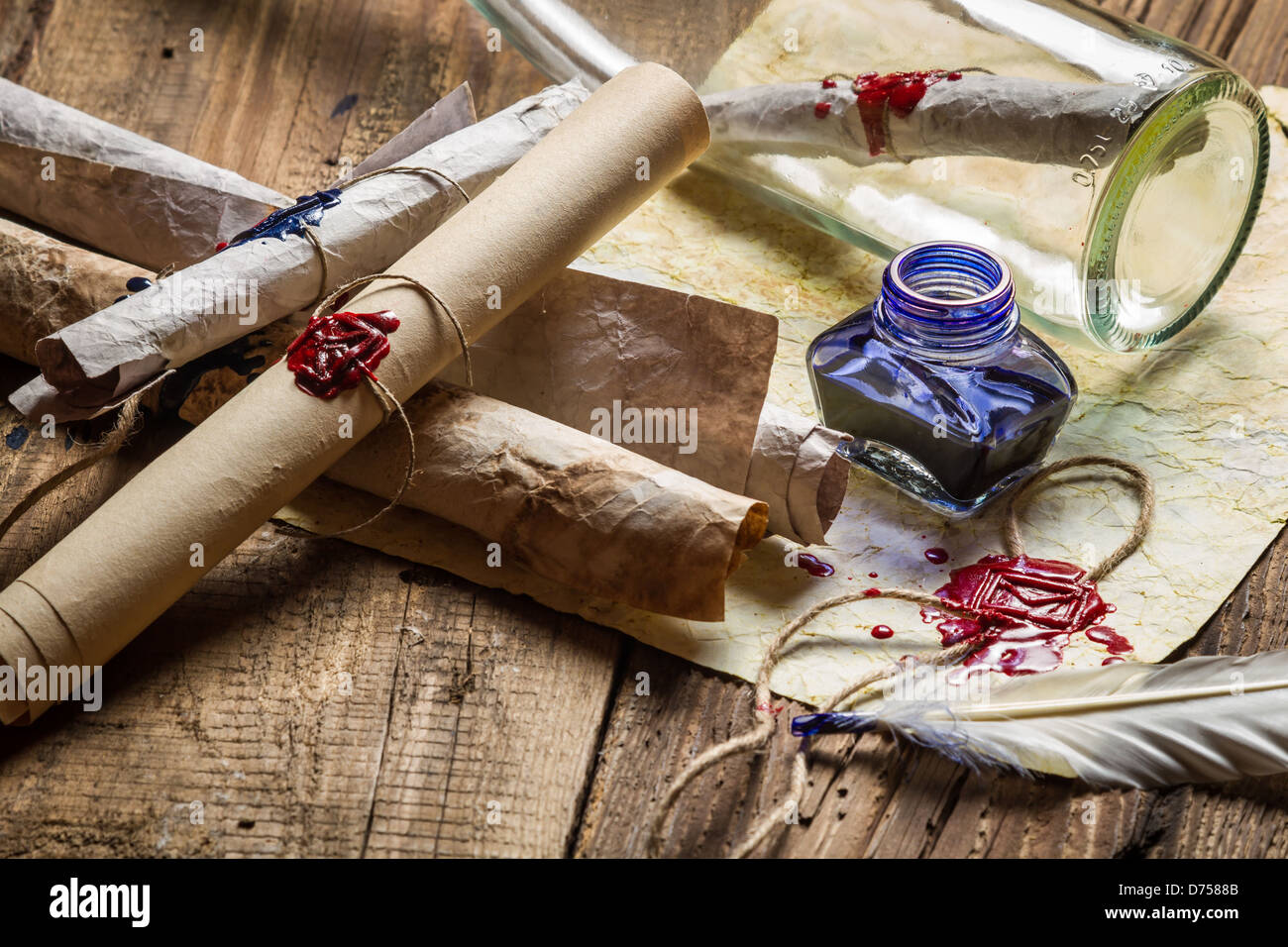 Vintage desk full of old scrolls scribe and blue ink Stock Photo - Alamy