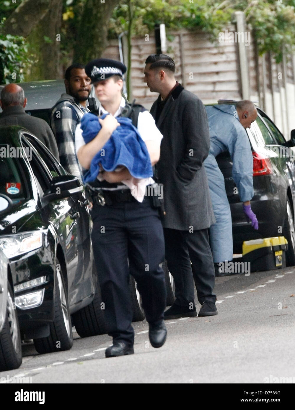 Reg Traviss is seen outside Amy Winehouse's home during the police ...