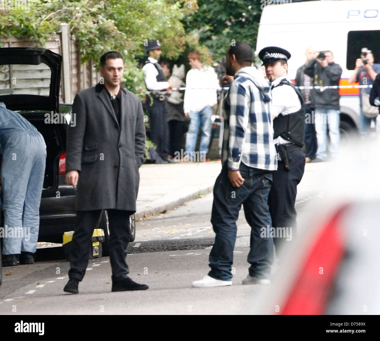 Reg Traviss is seen outside Amy Winehouse's home during the police ...