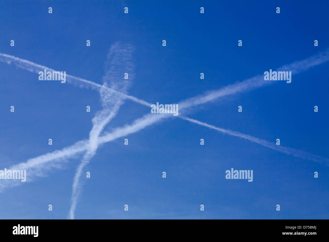 condensation trail forming a air cross in the sky Stock Photo - Alamy