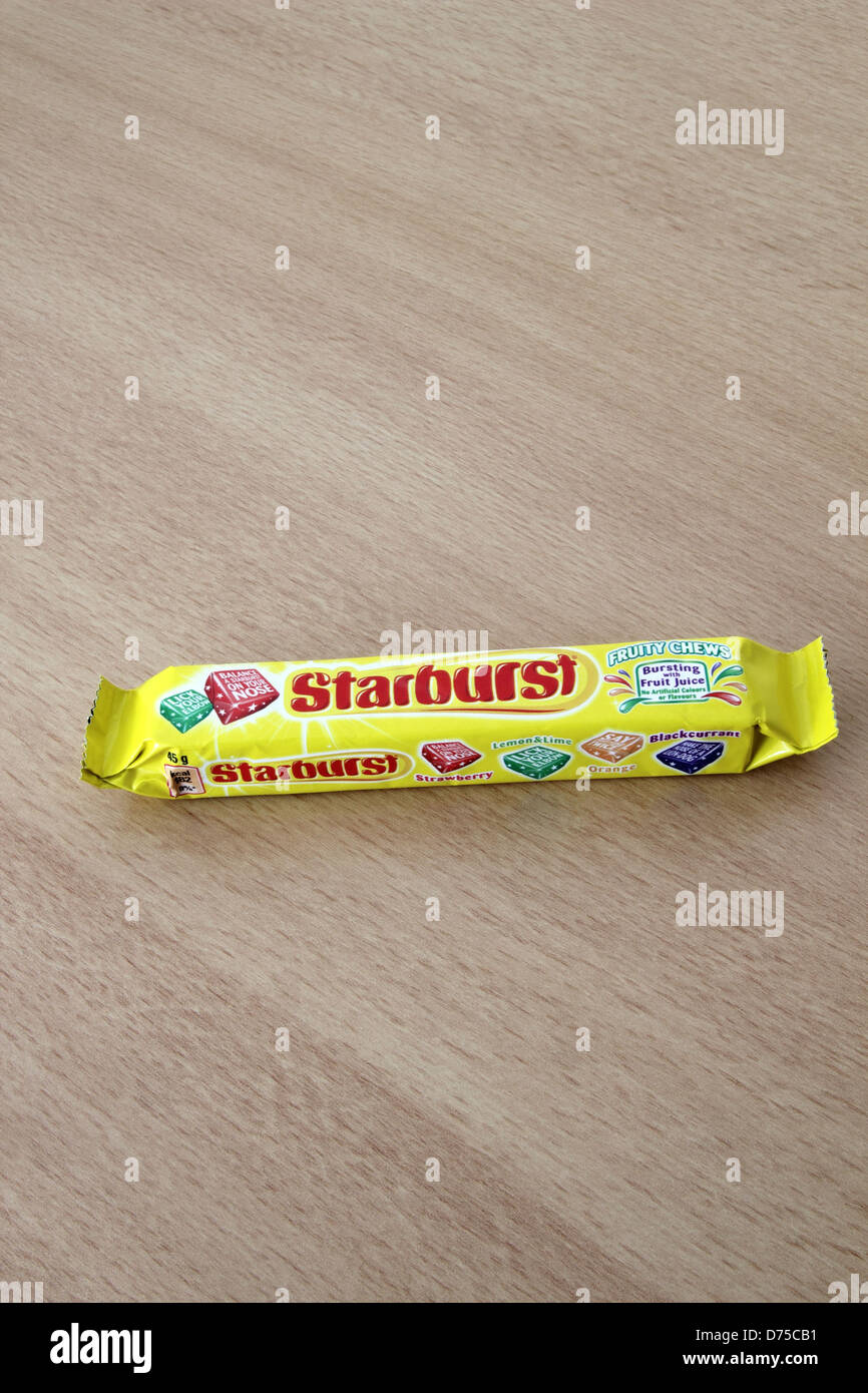 Packet of Starburst Sweets on a Wooden Background Stock Photo - Alamy