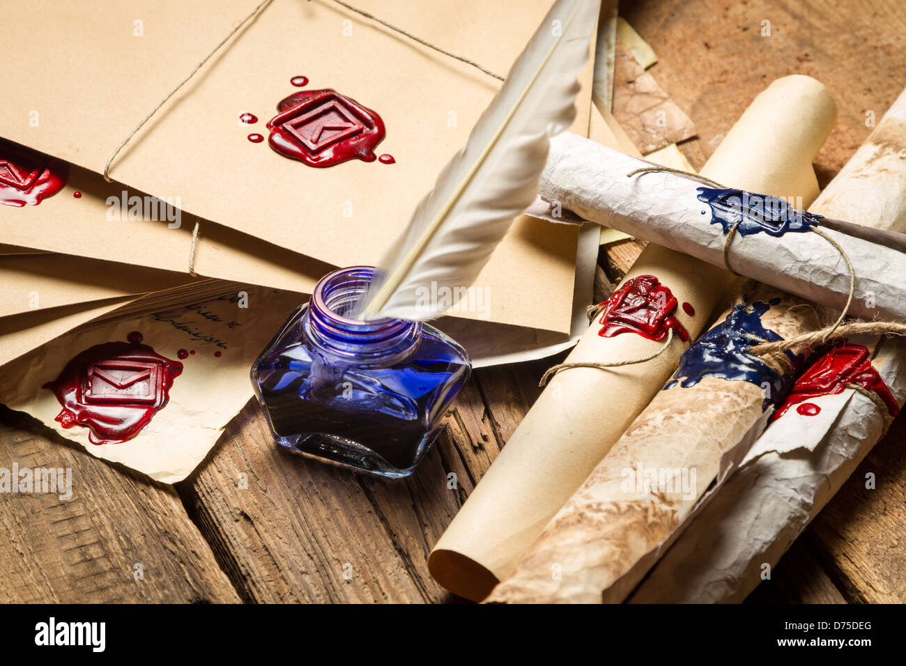 Closeup of ancient scrolls and old envelope with blue inkwell Stock ...
