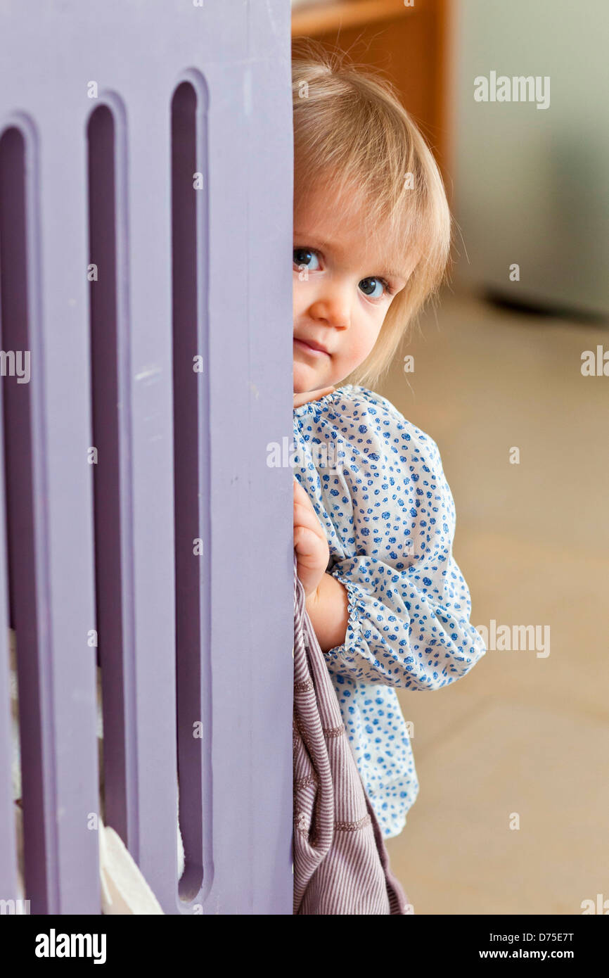 Timid girl hiding hi-res stock photography and images - Alamy