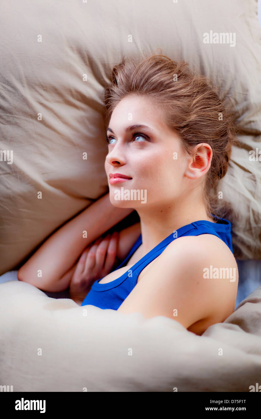 woman resting in bed Stock Photo - Alamy