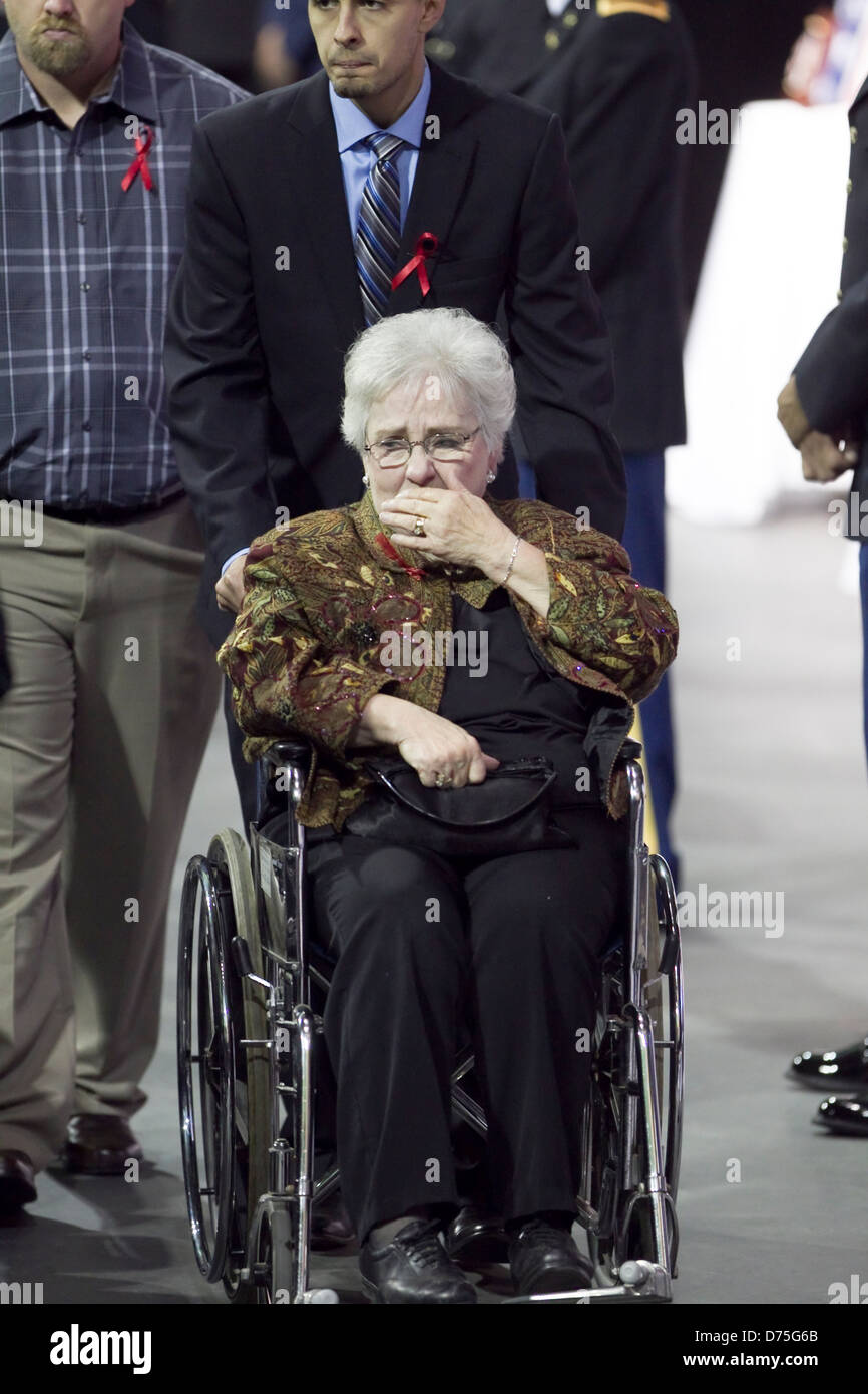 Woman in wheelchair mourns death of firefighters who died battling fire ...