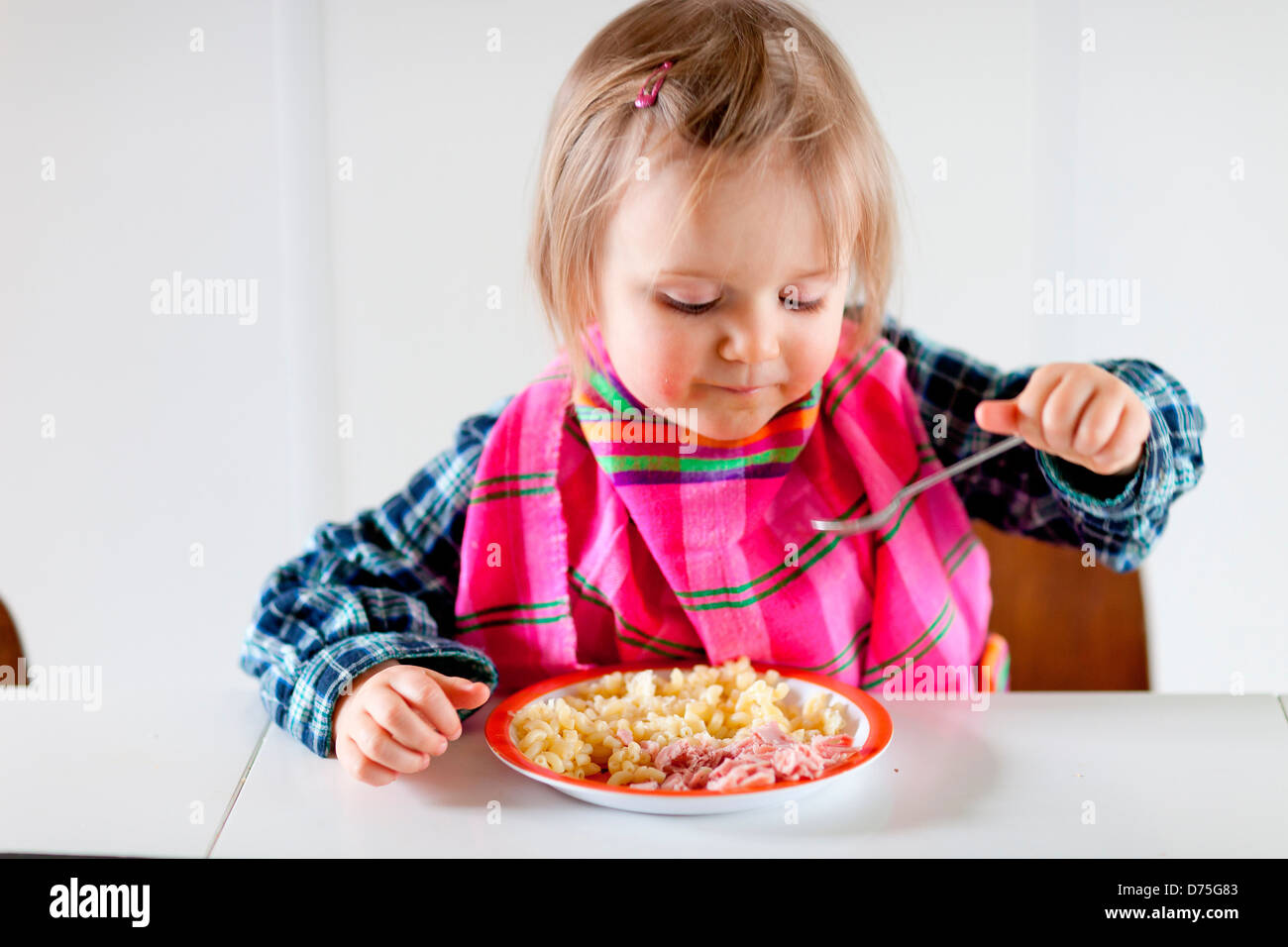 Baby eating alone hi-res stock photography and images - Alamy
