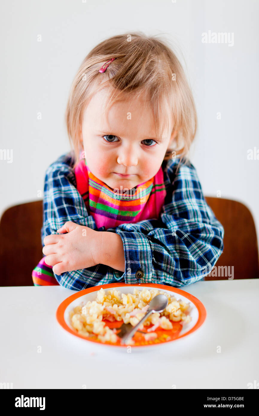 24 month old baby girl eating alone. Independence training Stock Photo ...