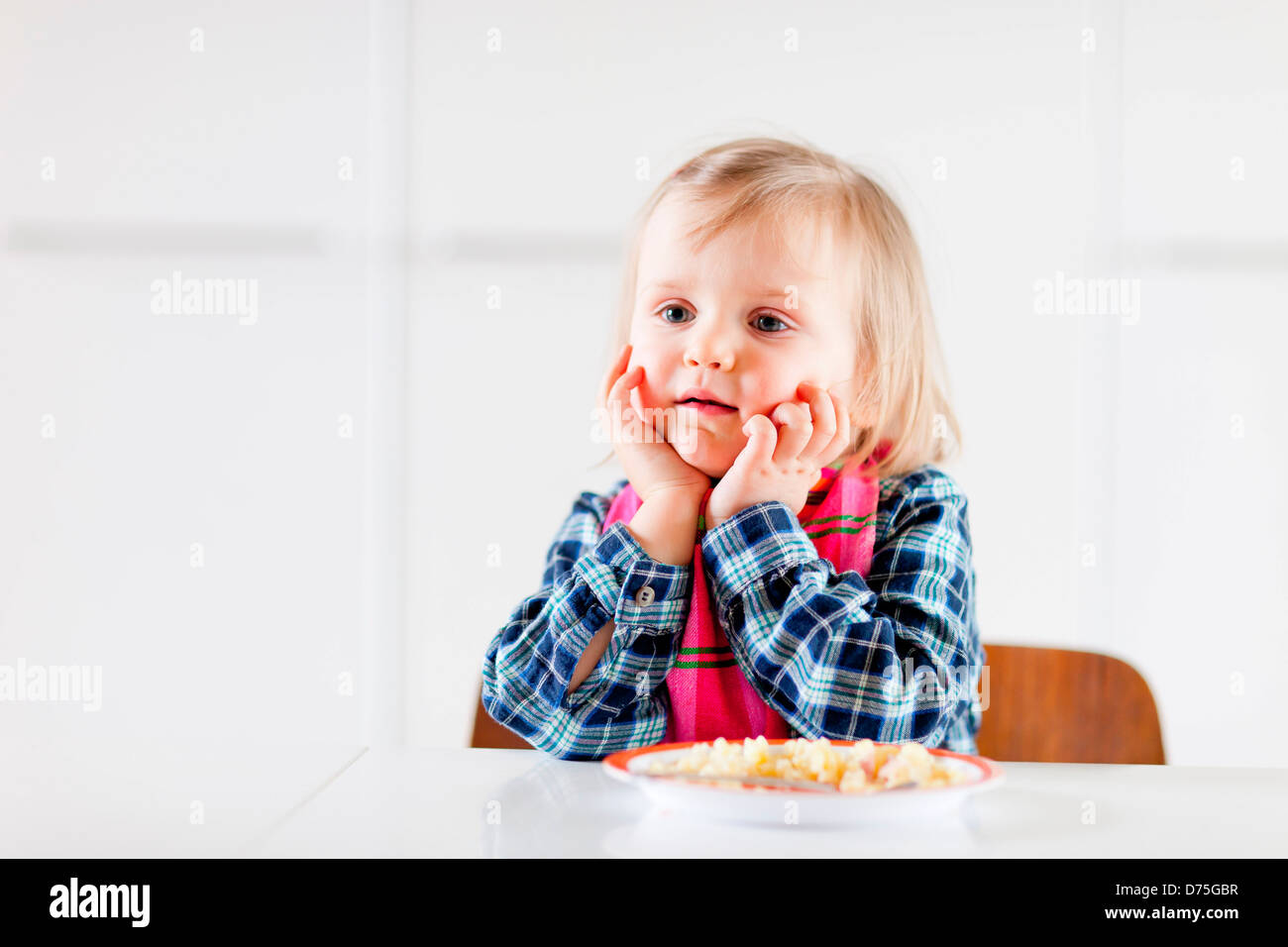 24 month old baby girl eating alone. Independence training Stock Photo ...