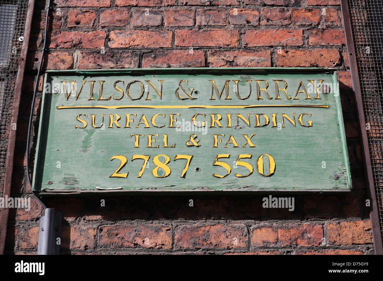 Old Factory name sign on a Derelict former Industrial Building near ...
