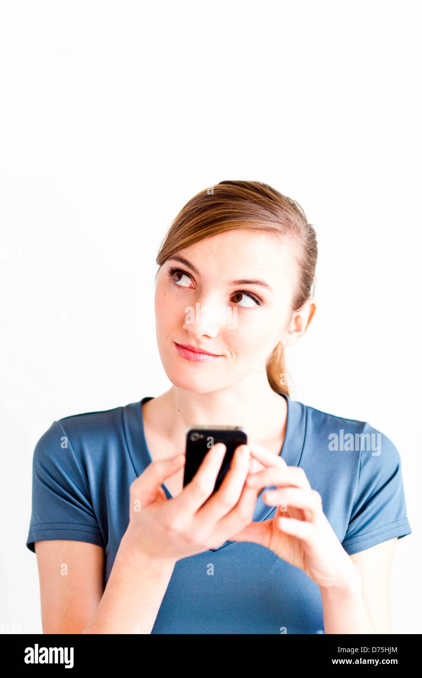 woman touching the screen of an iphone Stock Photo - Alamy