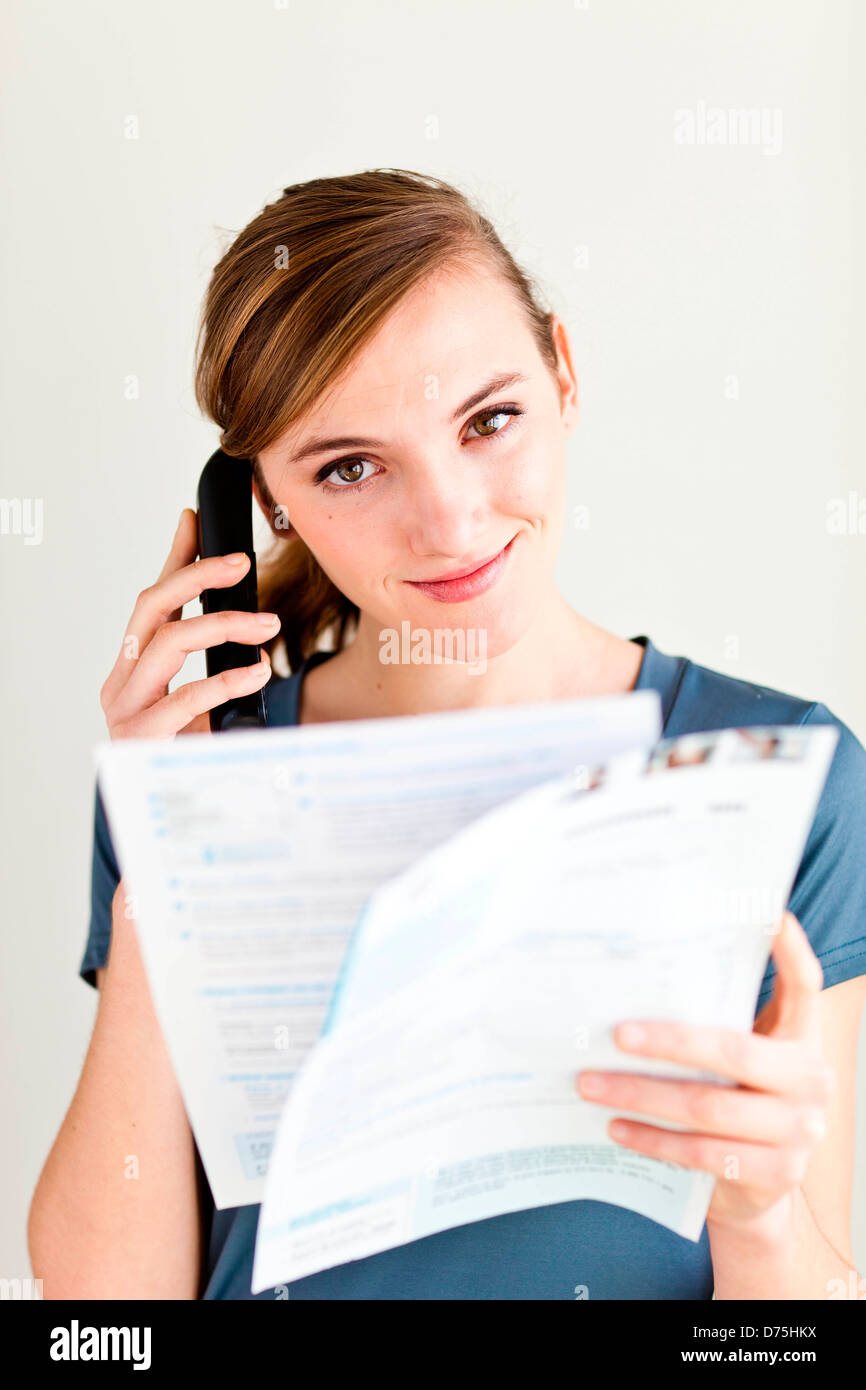 woman with administrative papers Stock Photo - Alamy