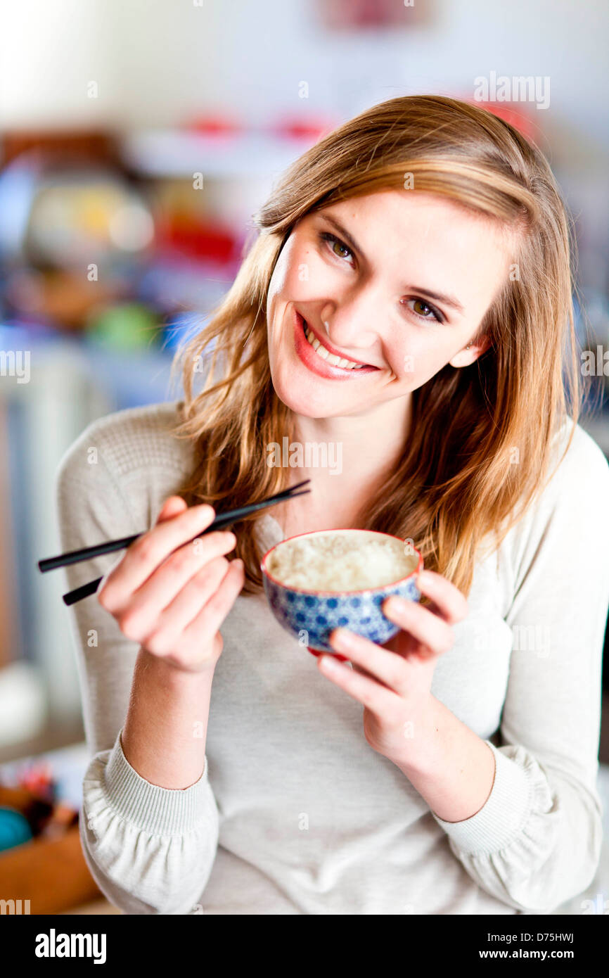woman eating rice Stock Photo - Alamy