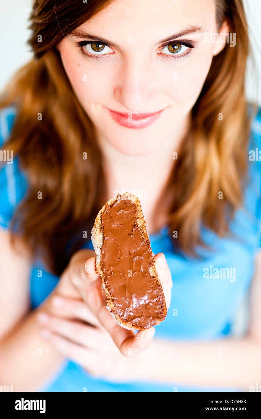 woman eating jam Nutella® Stock Photo - Alamy