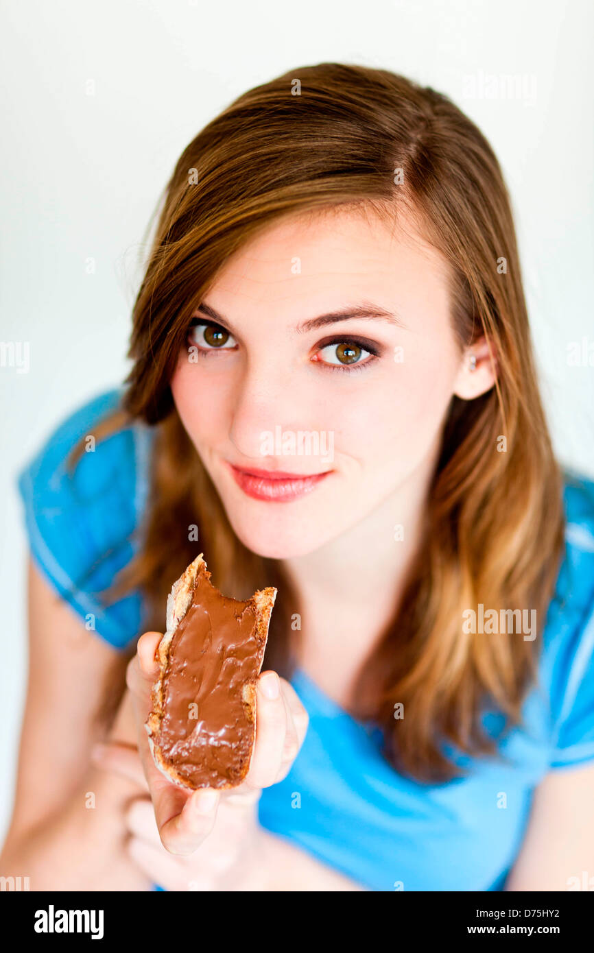 woman eating jam Nutella® Stock Photo - Alamy