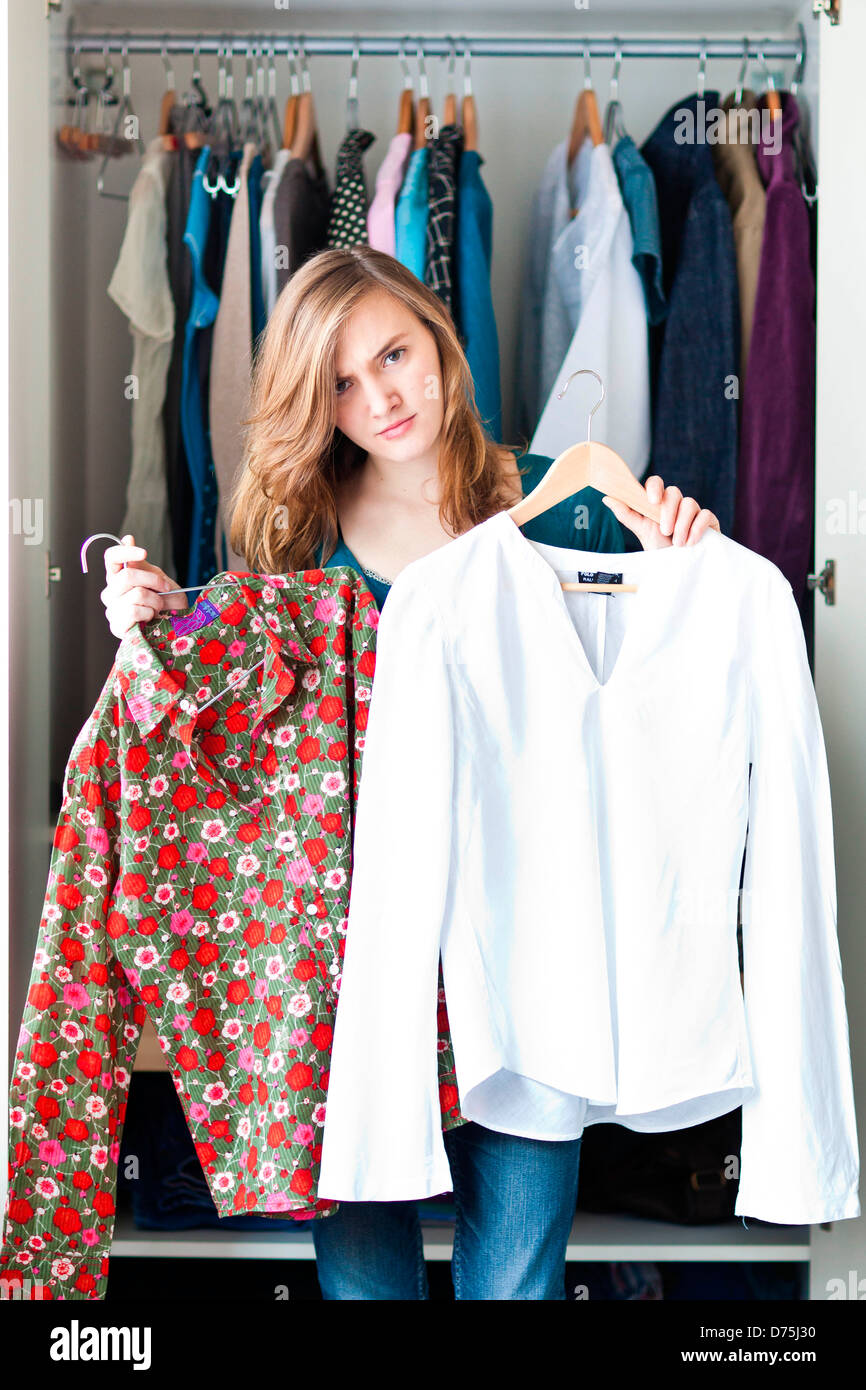 woman choosing clothes Stock Photo - Alamy