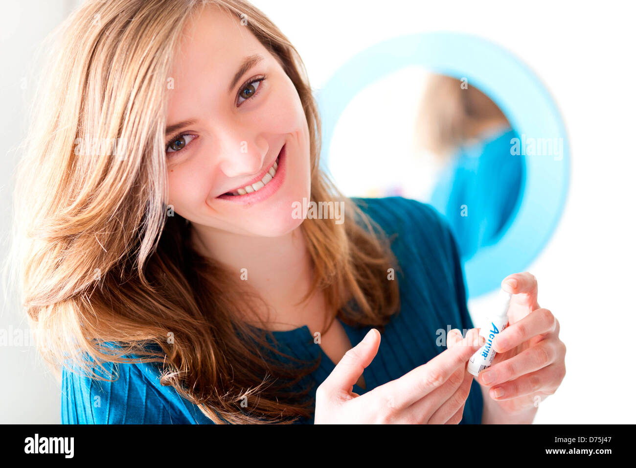 Woman applying ointment on lips hi-res stock photography and images - Alamy
