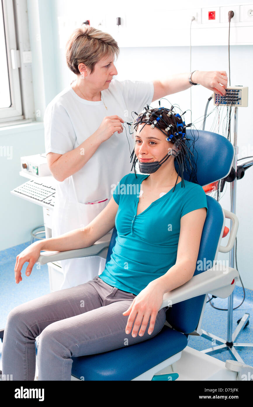 woman undergoing an electroencephalogram (EEG). Limoges hospital ...