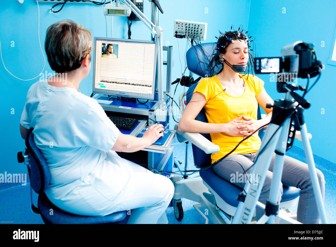 woman undergoing an electroencephalogram (EEG). Limoges hospital ...