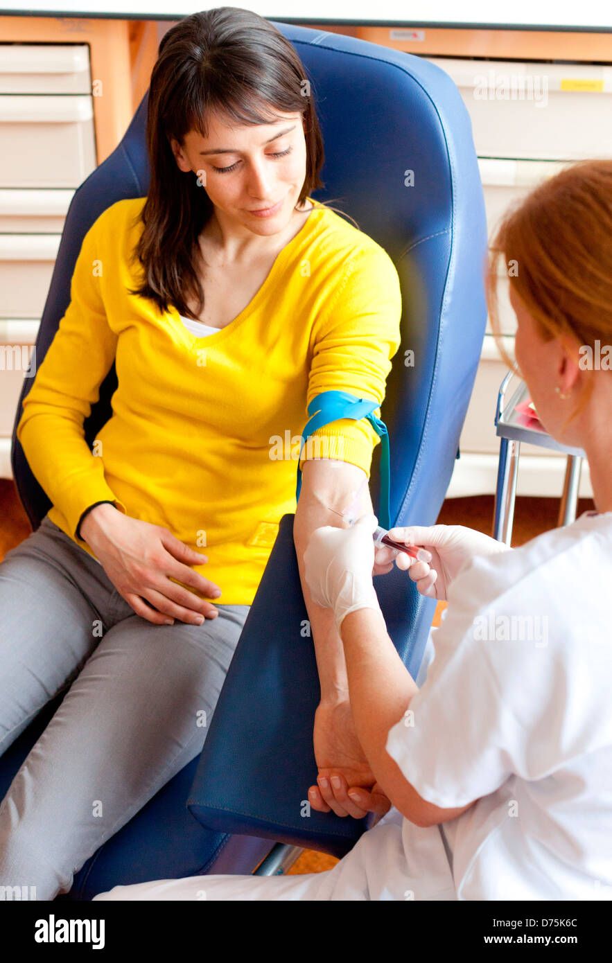 Young woman having a blood sample Stock Photo - Alamy