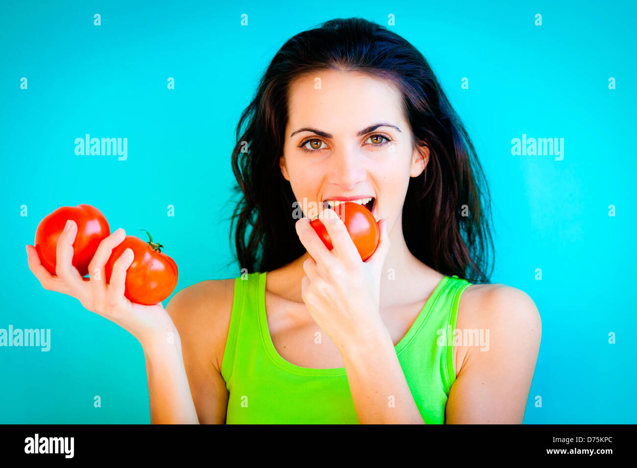 woman eating tomatoes Stock Photo - Alamy