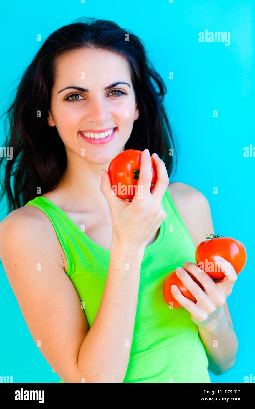 woman eating tomatoes Stock Photo - Alamy