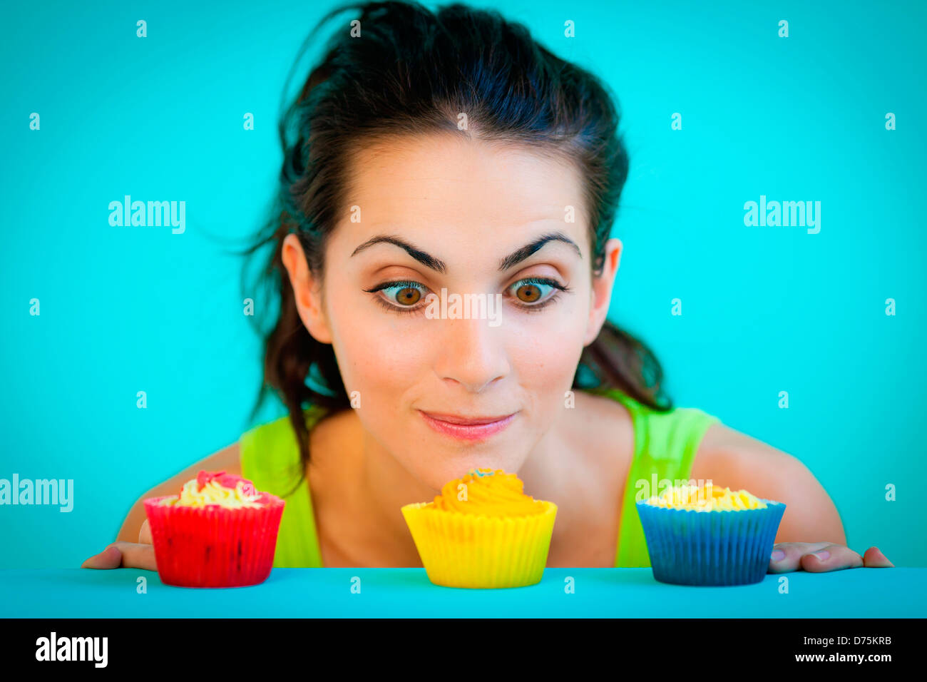 woman eating cupcakes Stock Photo - Alamy