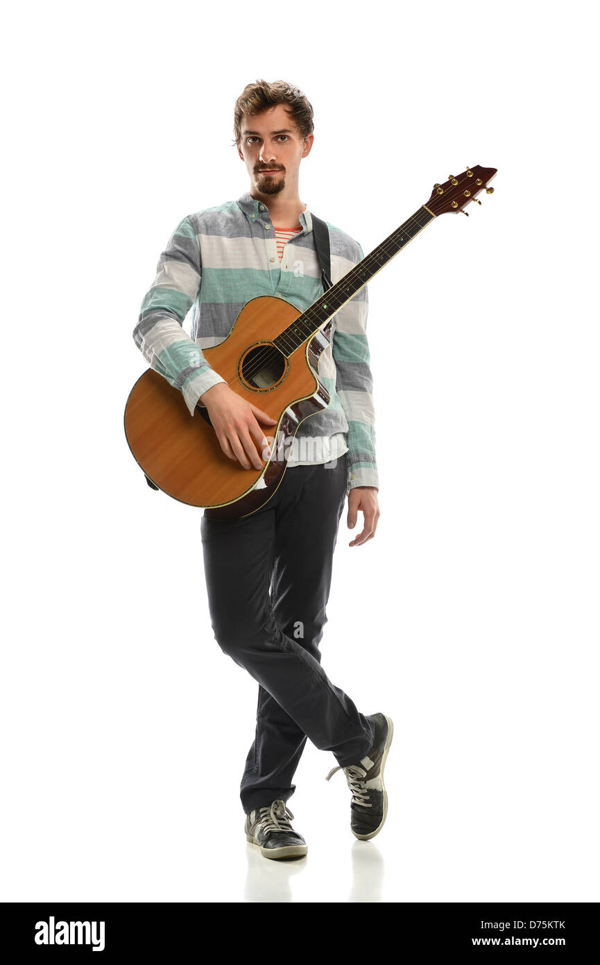 Young man with acoustic guitar standing over white background Stock ...