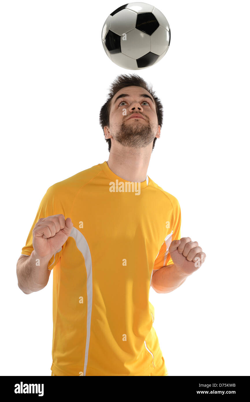 Portrait of soccer player heading ball isolated over white background ...