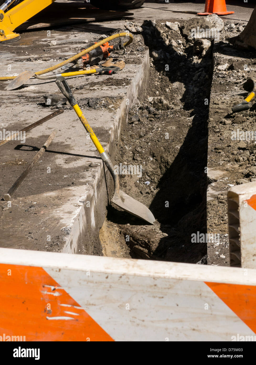 Open Freshly Dug Street Trench, Shovel and Barrier, NYC Stock Photo - Alamy