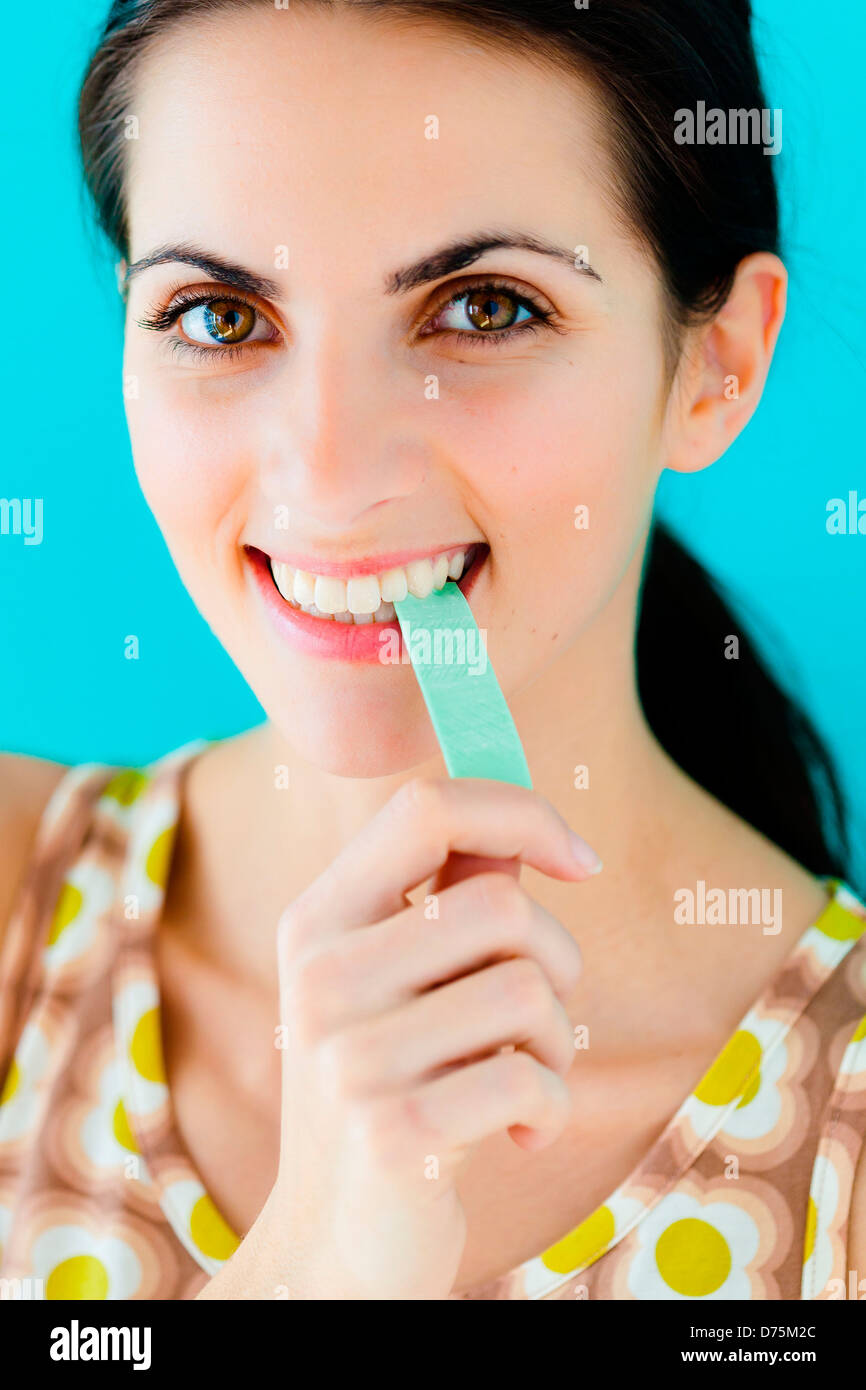 Woman eating chewing gum hi-res stock photography and images - Alamy