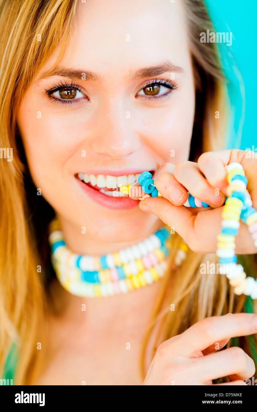 Woman eating candy Stock Photo - Alamy