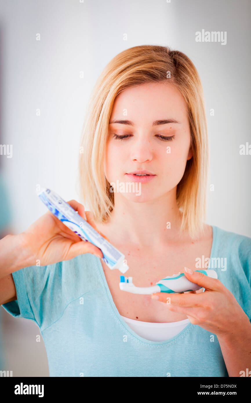 Woman brushing her teeth Stock Photo - Alamy
