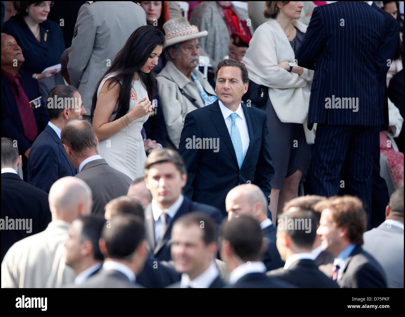 Industry Minister Eric Besson arrives with his wife Yasmine Tordjman ...