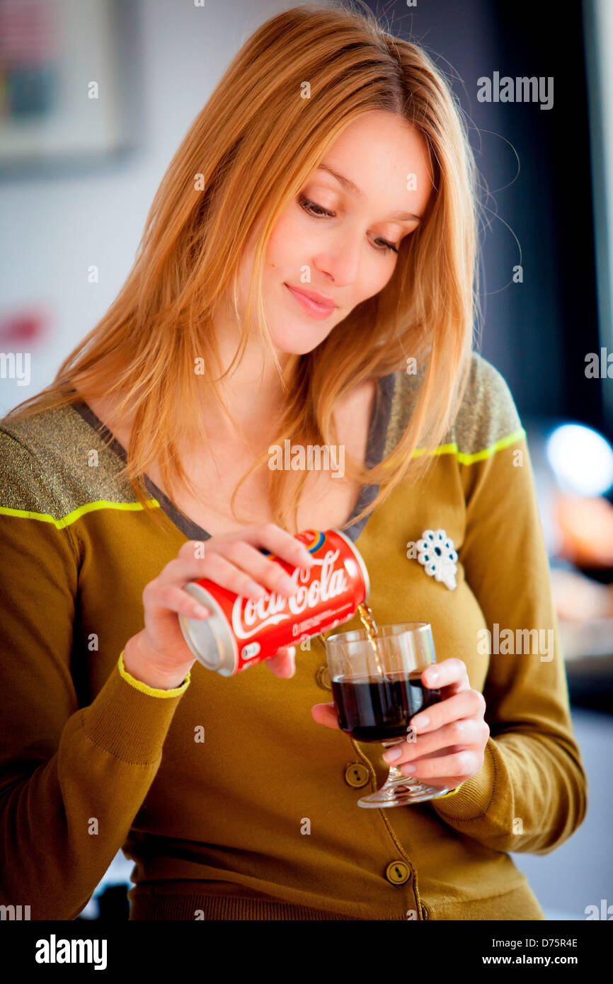 Woman drinking a soda Stock Photo - Alamy