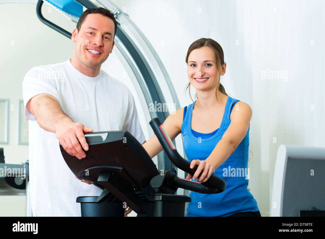 Patient at the physiotherapy making physical exercises with her ...