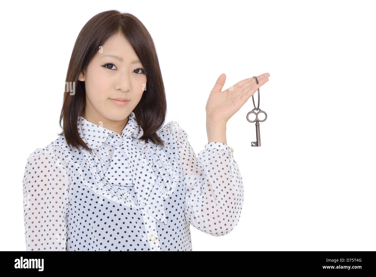 Happy girl with key in hand hi-res stock photography and images - Alamy