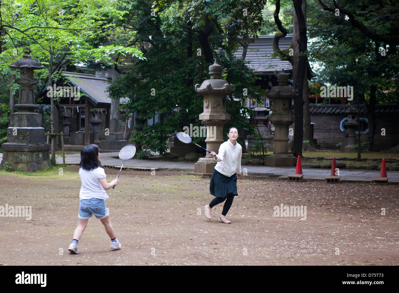 Japanese woman and girl playing badminton in the park, Tokyo Stock ...