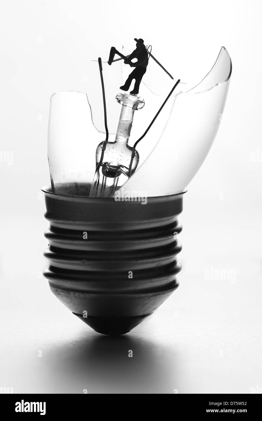Broken Bulb with man working on the fix Stock Photo - Alamy