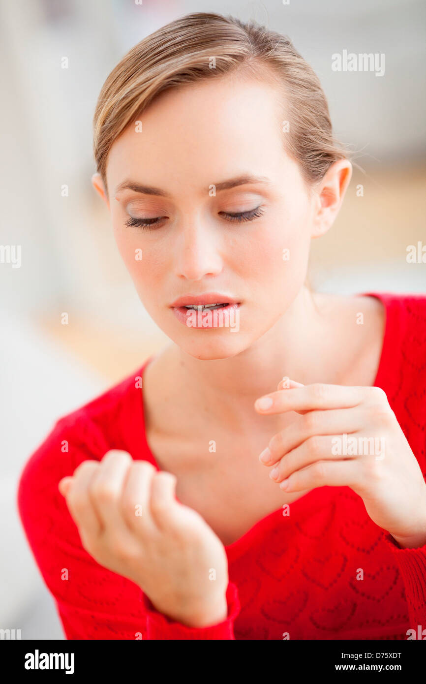 Woman watching her hands Stock Photo - Alamy