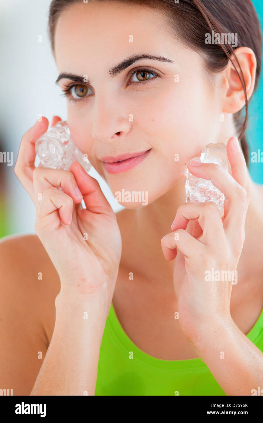 Woman ice cube on face hi-res stock photography and images - Alamy