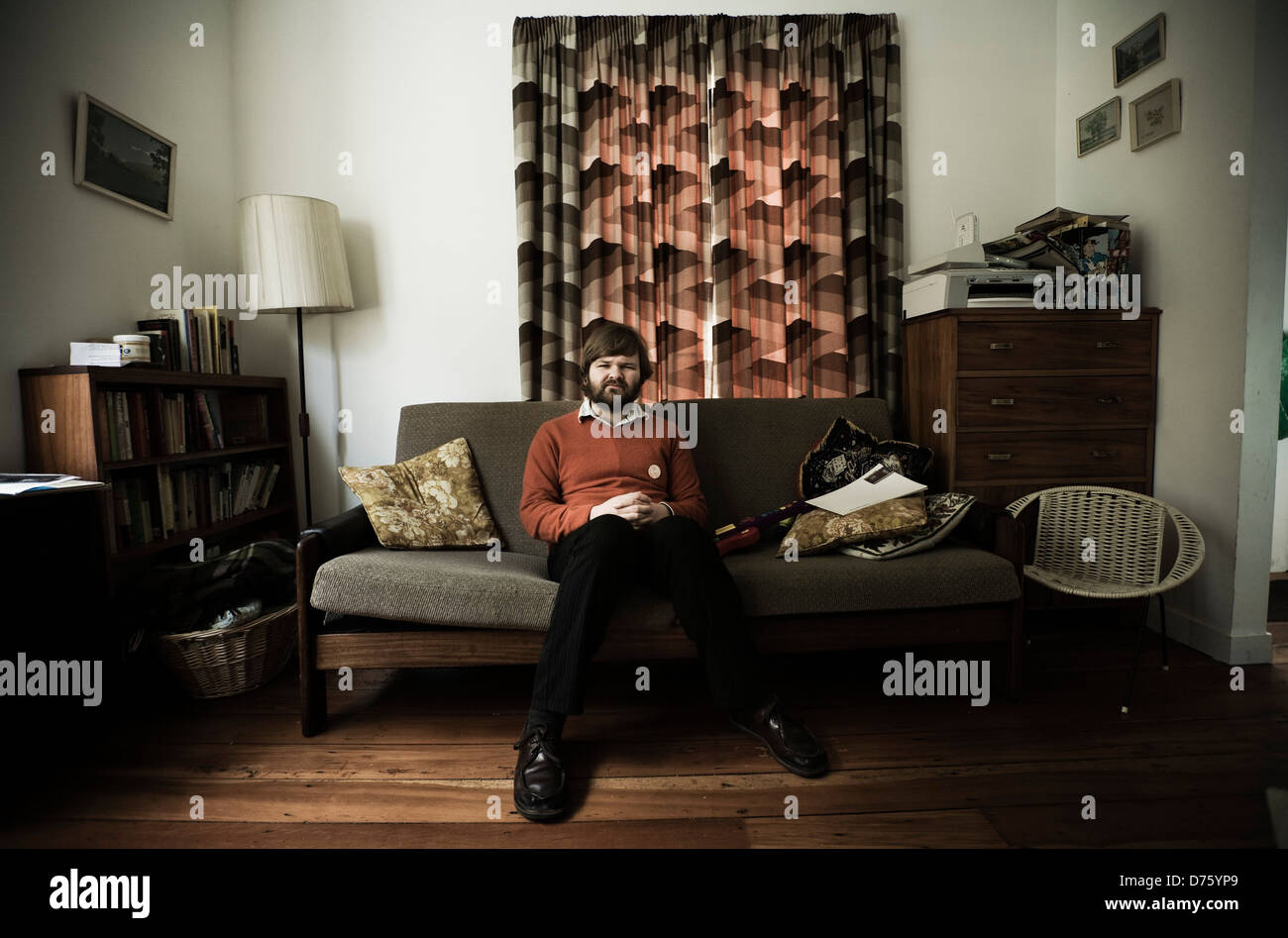 Luke Buda (Phoenix Foundation) in his living room Stock Photo - Alamy