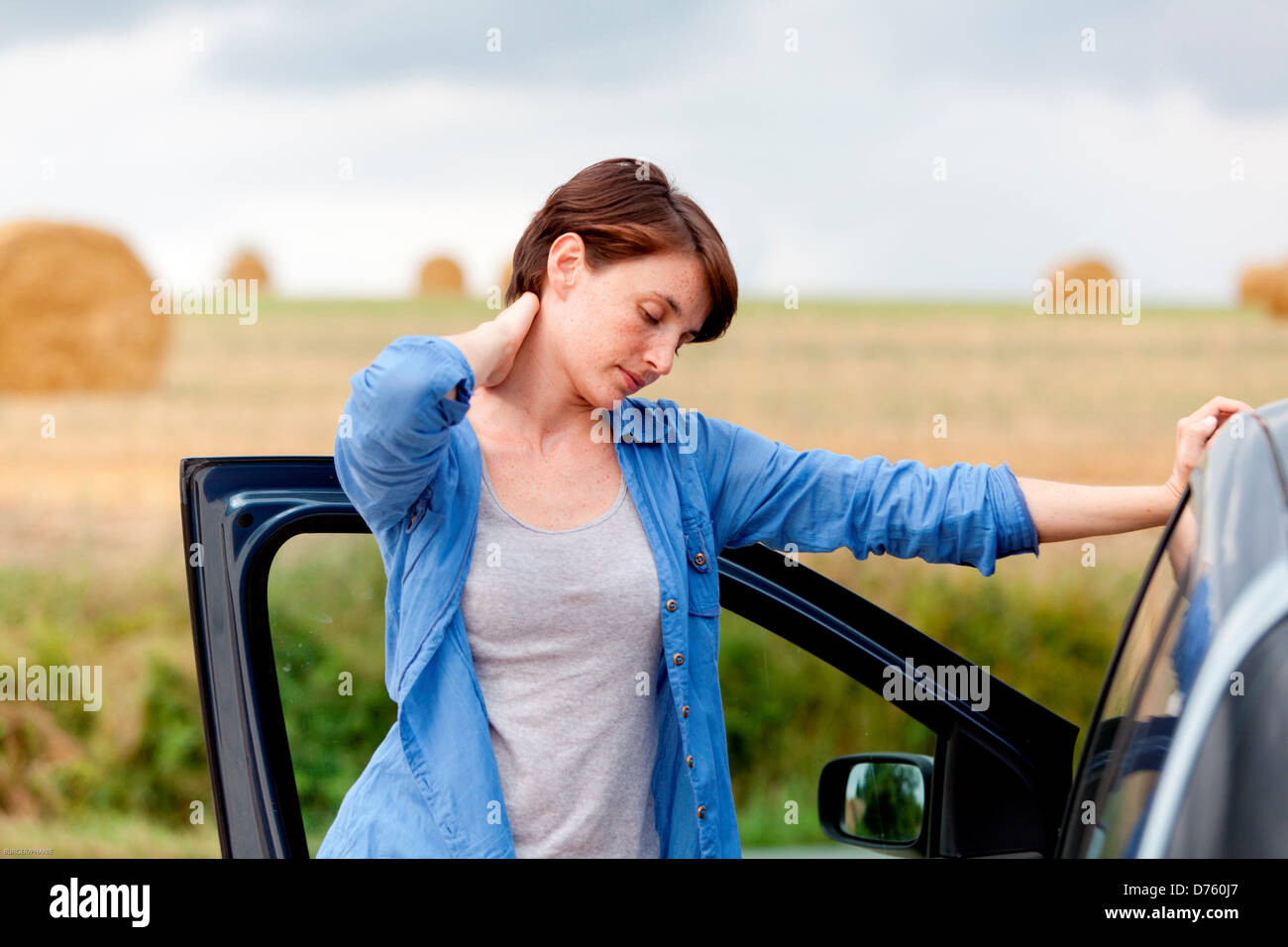 Woman suffering from neck pain or drowsiness driving Stock Photo - Alamy