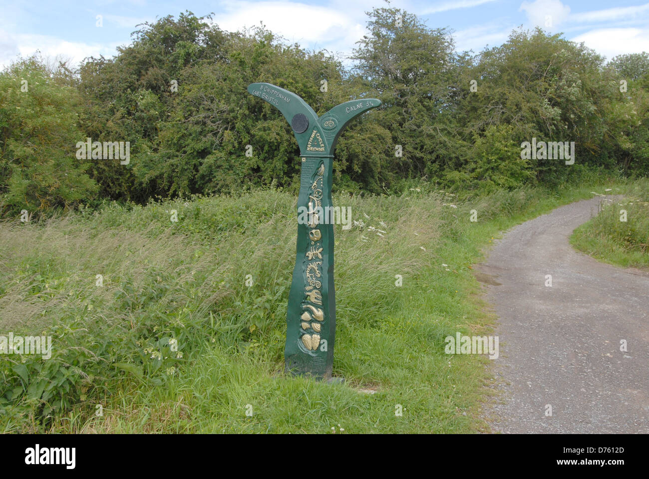 A cast iron milepost marking an entrance to the cycle path along the ...