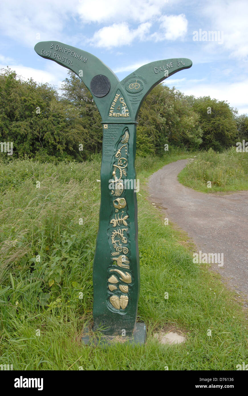 A cast iron milepost marking an entrance to the cycle path along the ...
