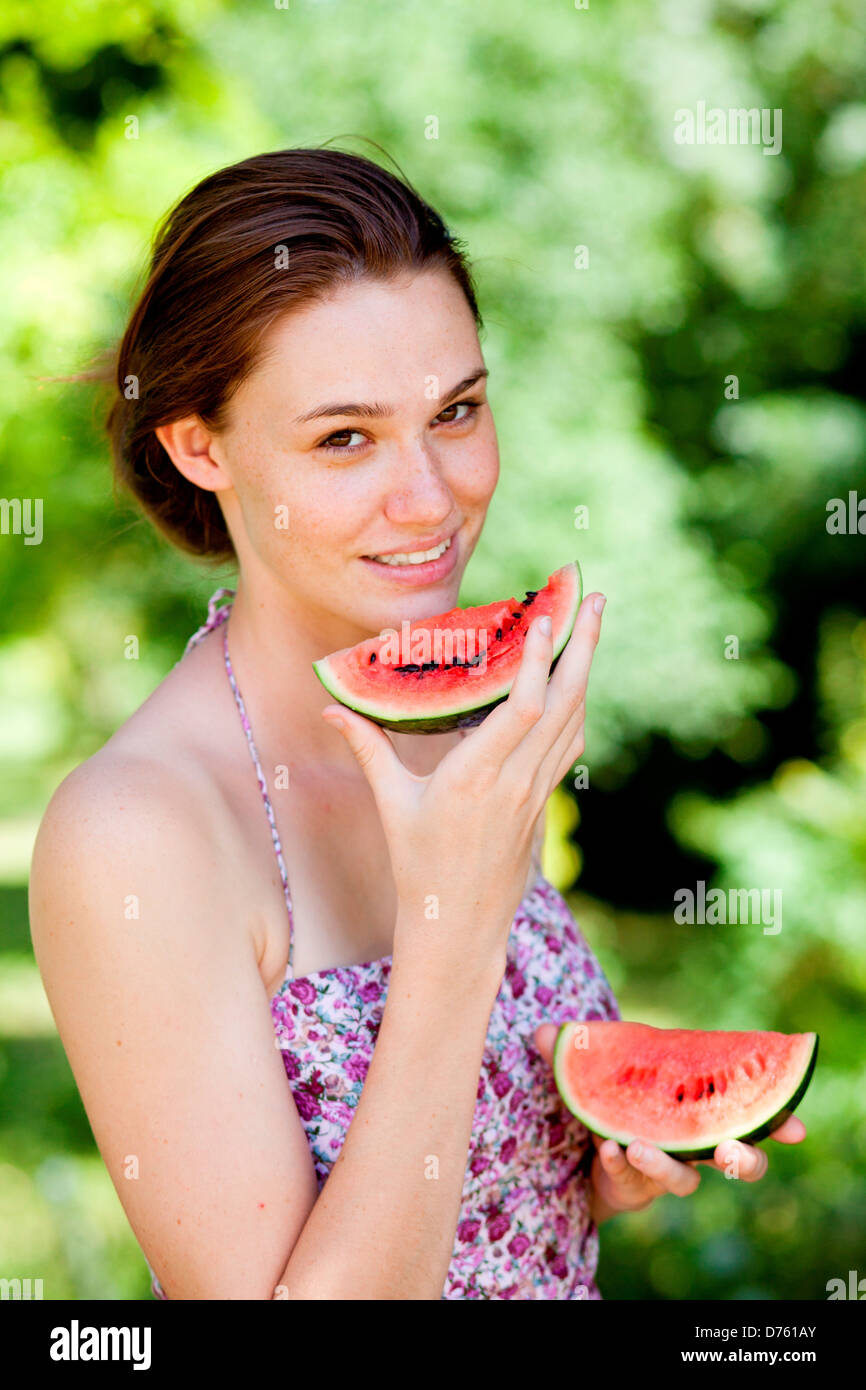 Woman eating watermelon Stock Photo - Alamy