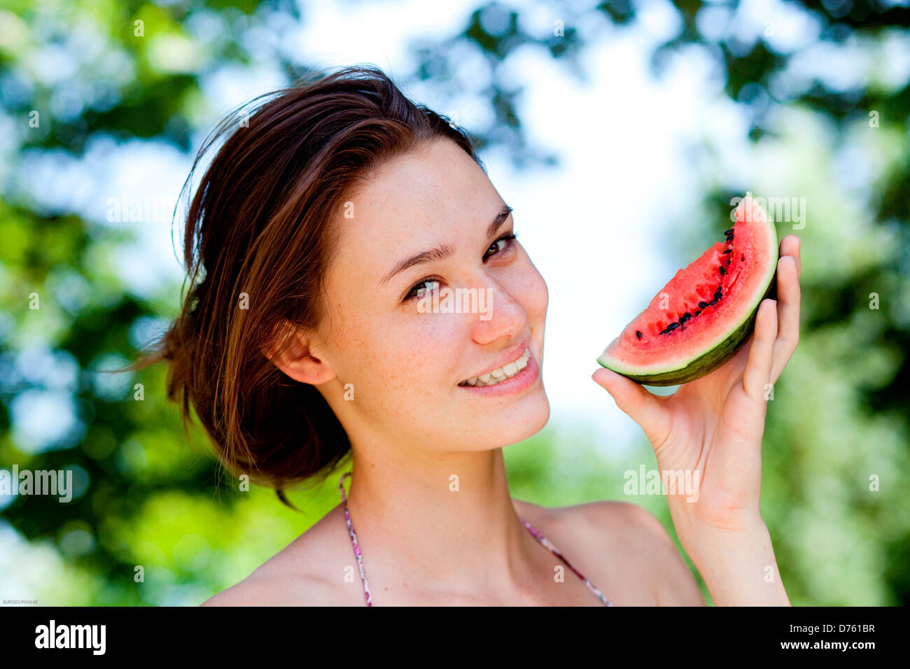 Woman eating watermelon Stock Photo - Alamy
